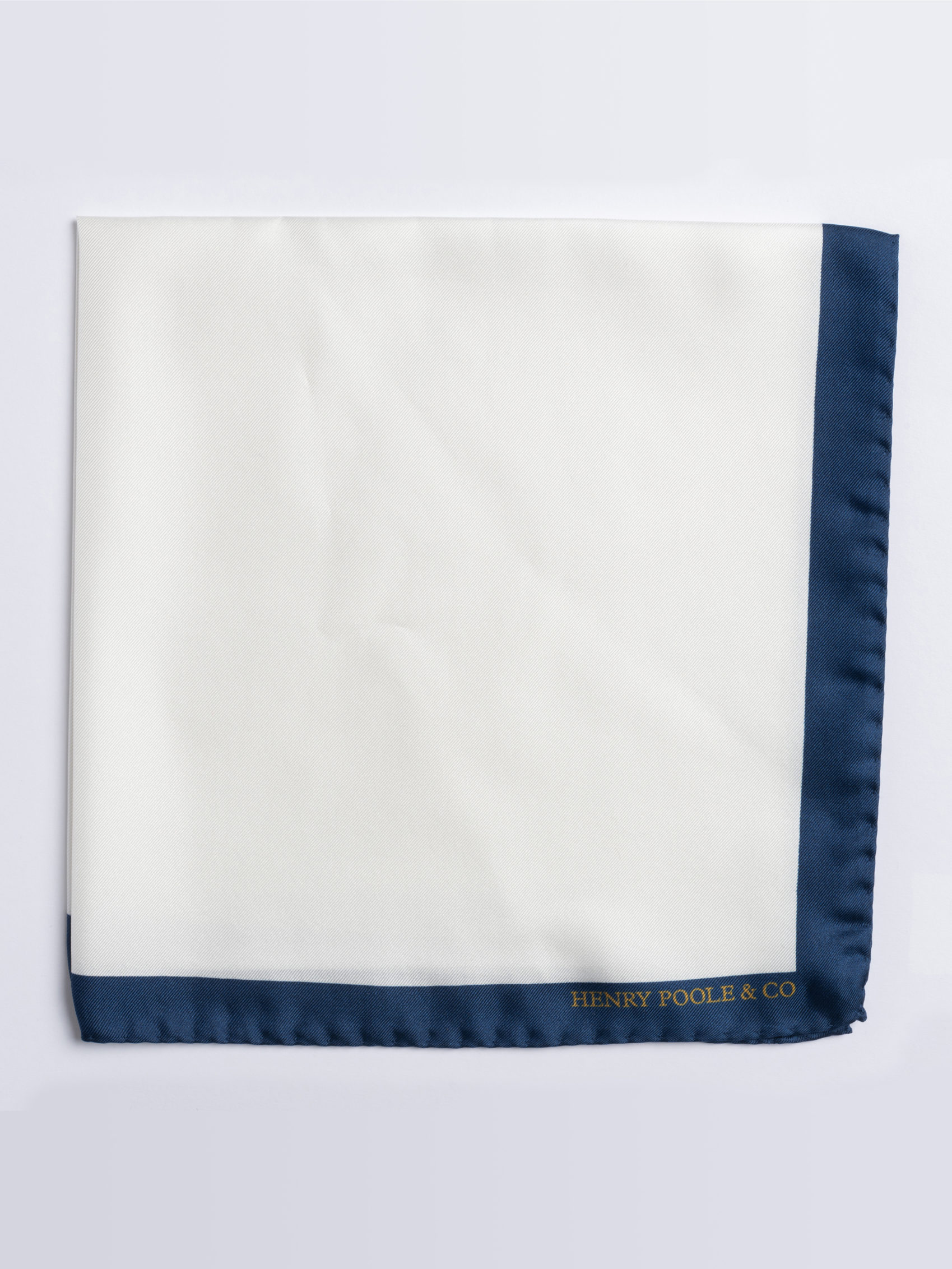 Ivory with navy pocket square - Henry Poole Savile Row